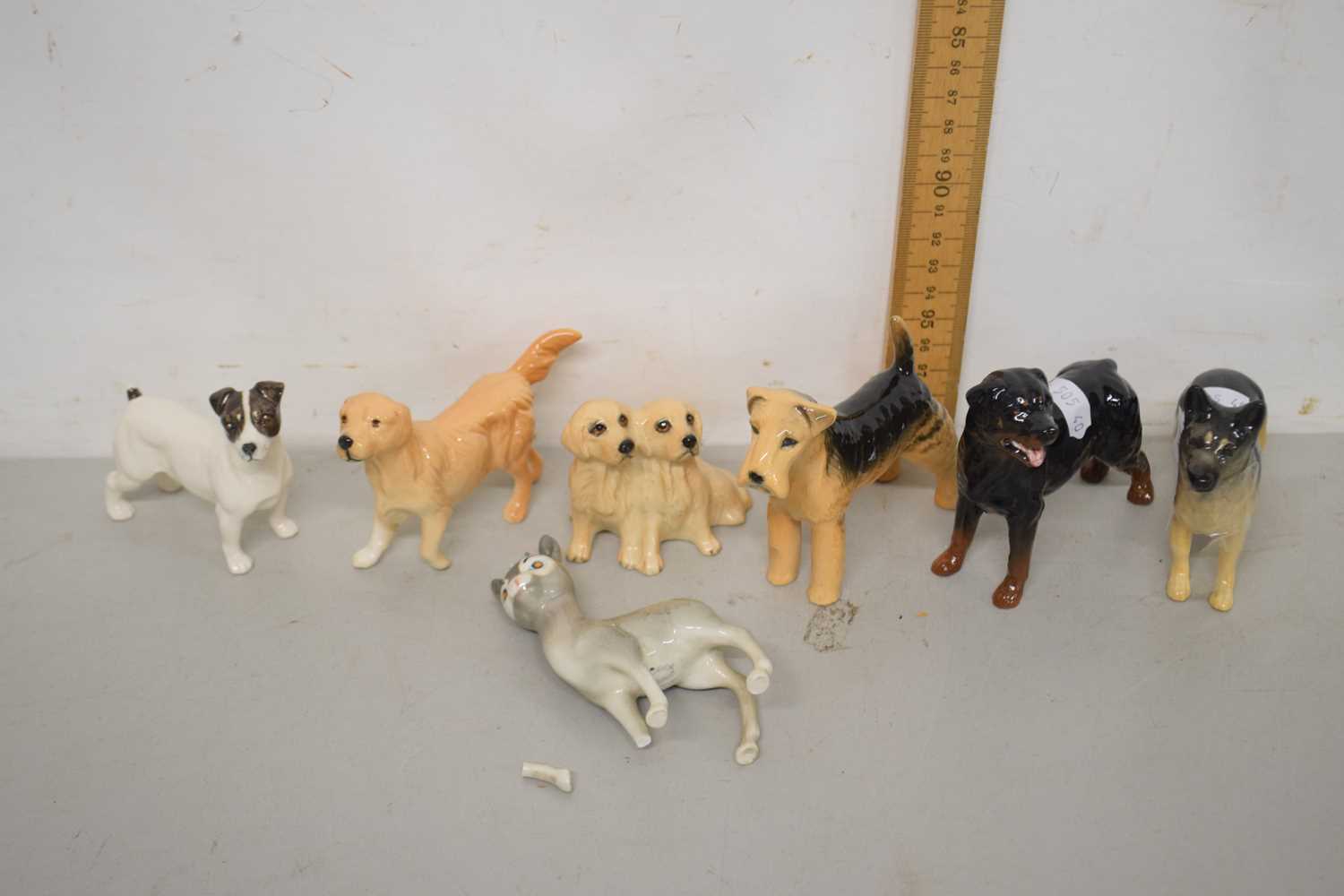 Lot 82 - A group of Beswick dogs and a further fawn