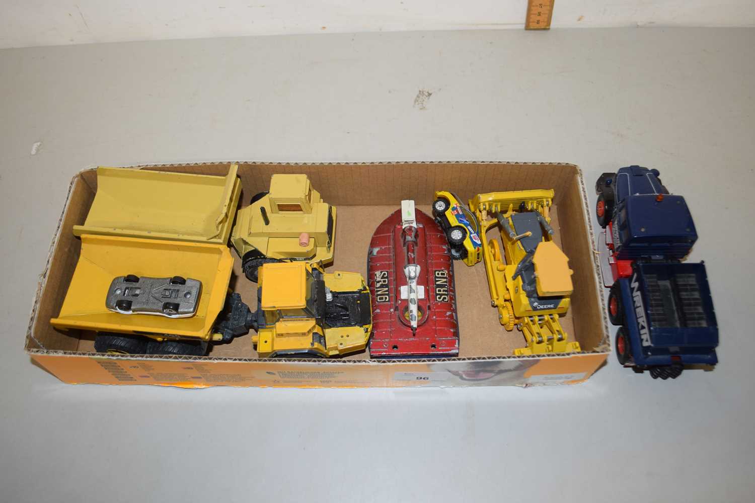 Lot 96 - A box of various toy construction vehicles to