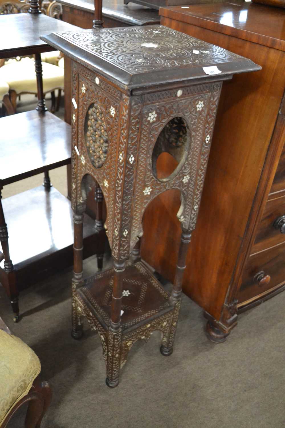 Lot 597 - A Moorish mother of pearl inlaid and heavily