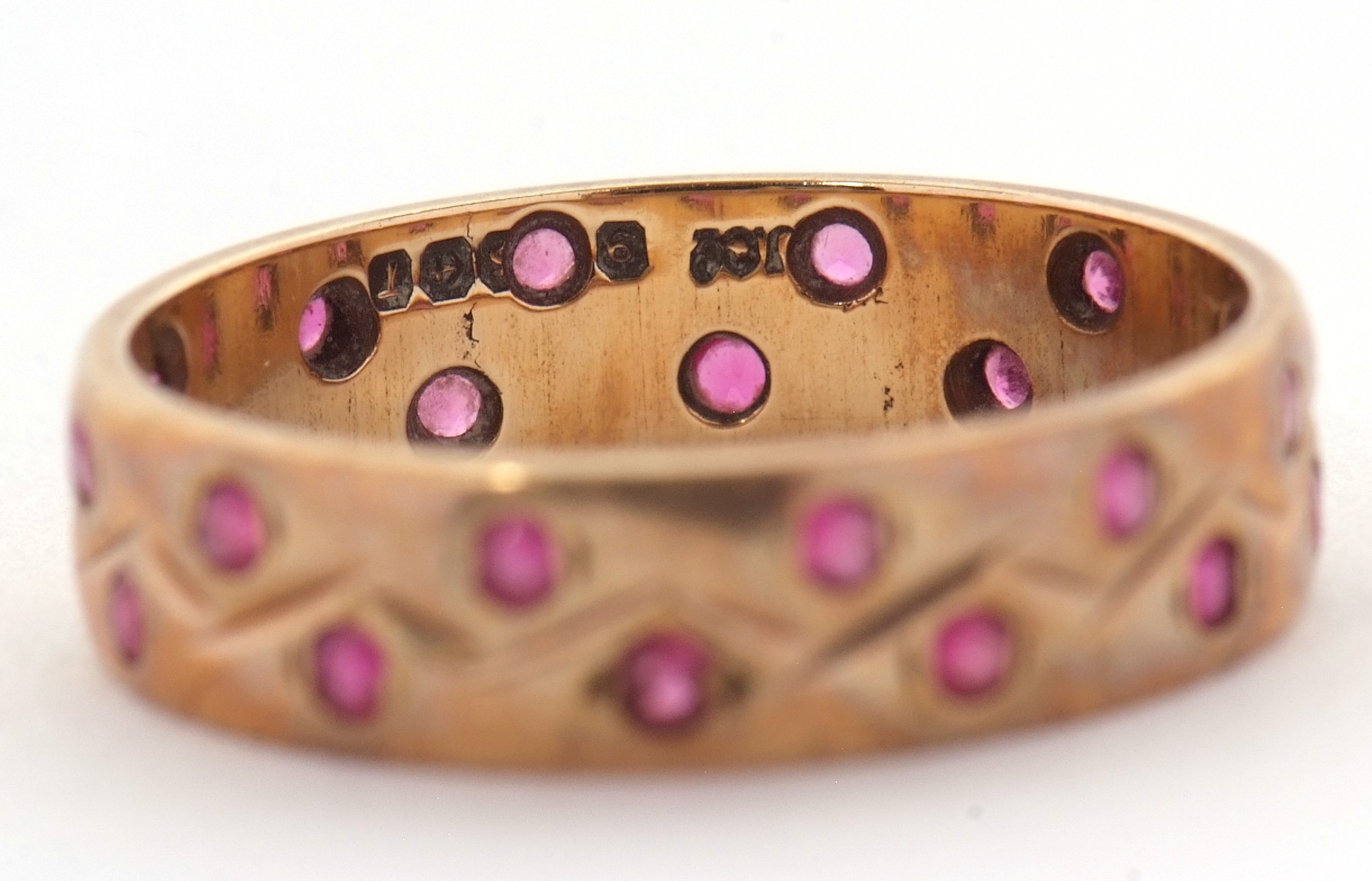 Lot 34 - A 9ct ruby ring, the 4mm wide band set with