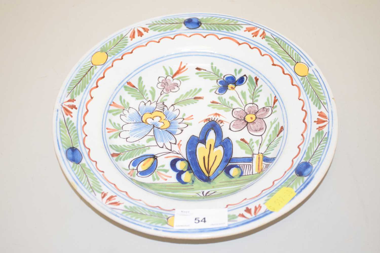 Lot 54 - An 18th Century polychrome Delft dish