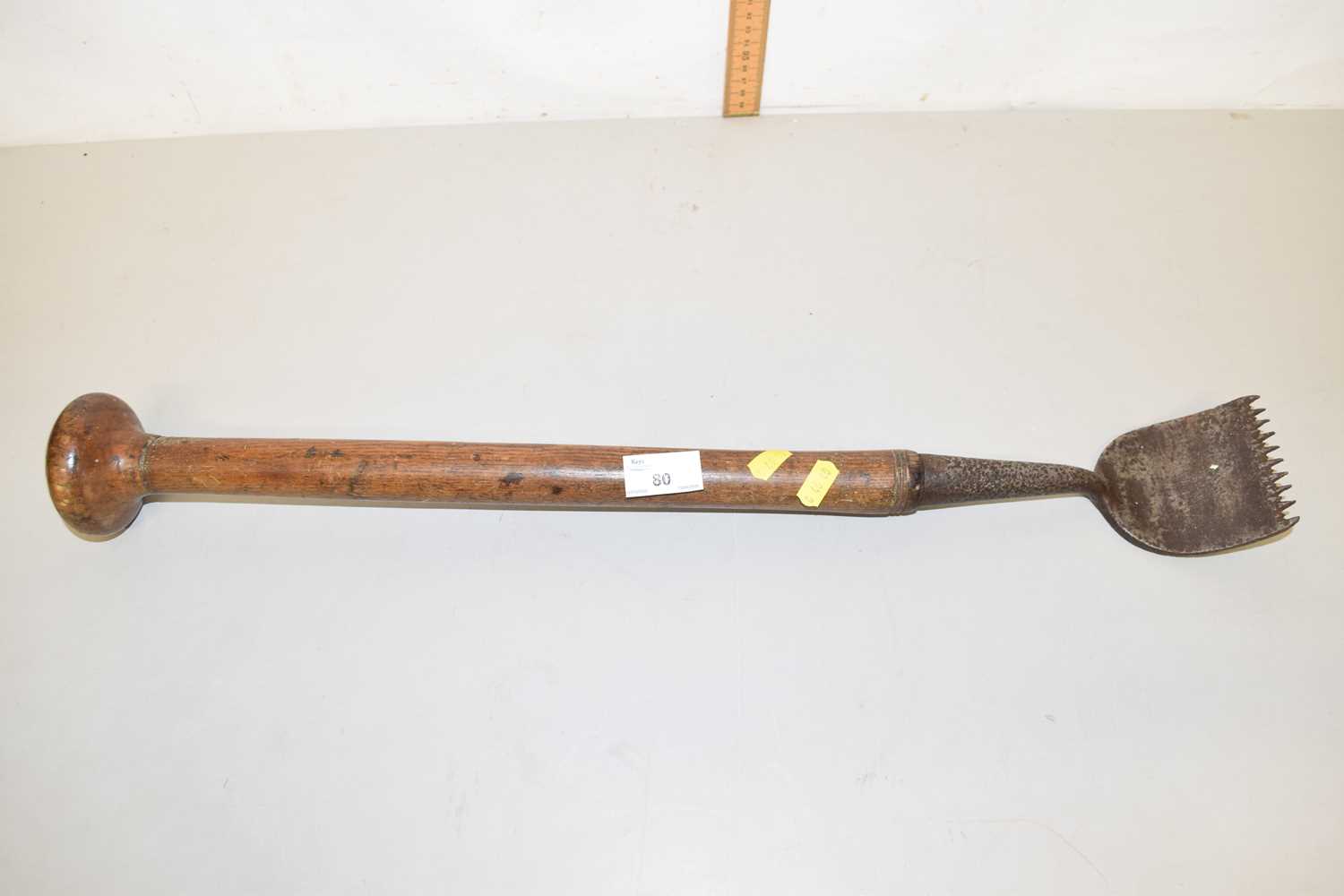 Lot 80 - A vintage digging tool with wooden handle