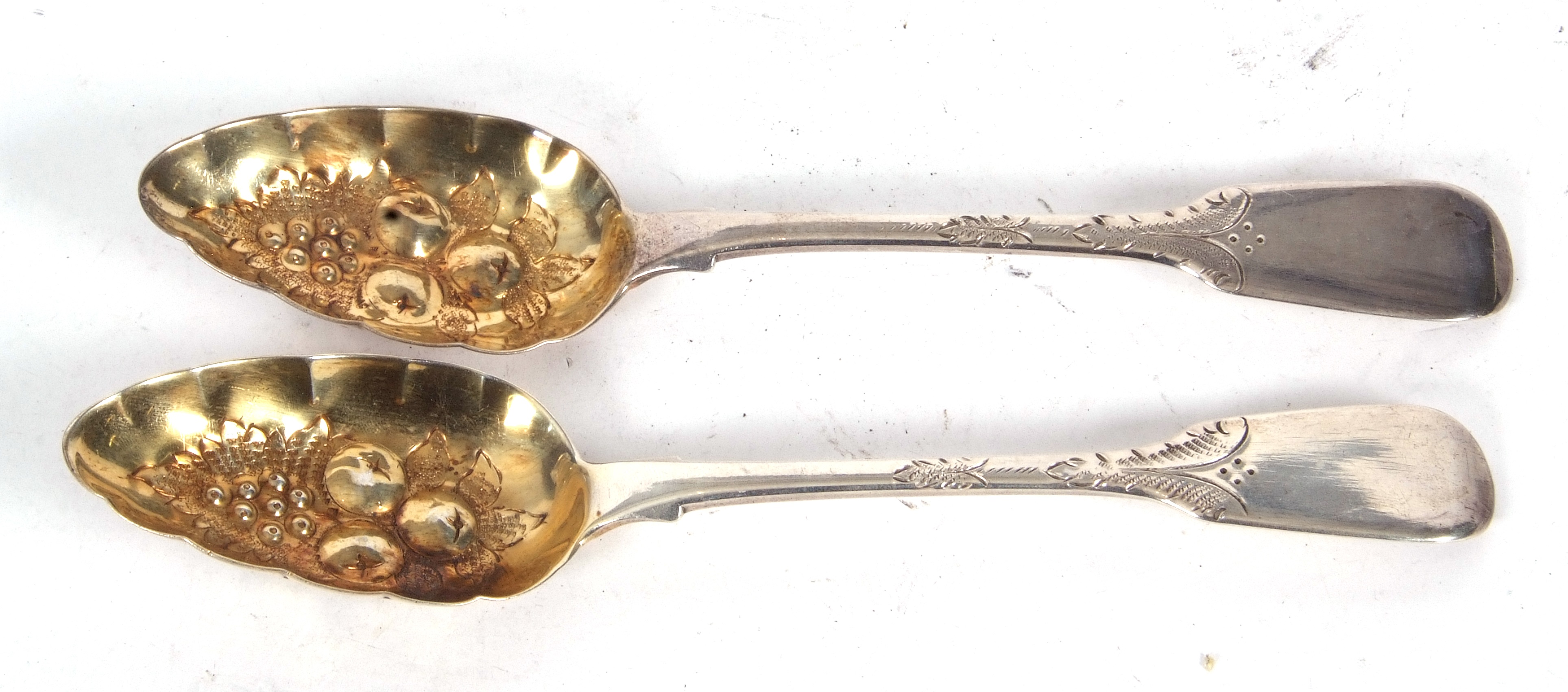 Lot 138 - A pair of silver fiddle pattern berry spoons