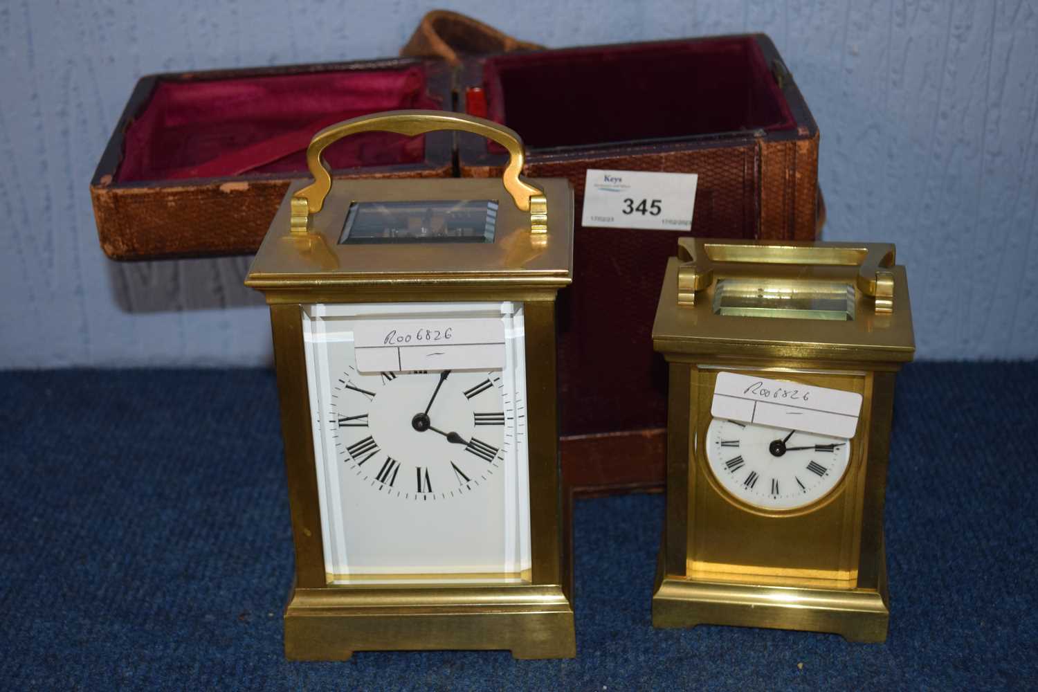 Lot 345 - A carriage clock in case together with a