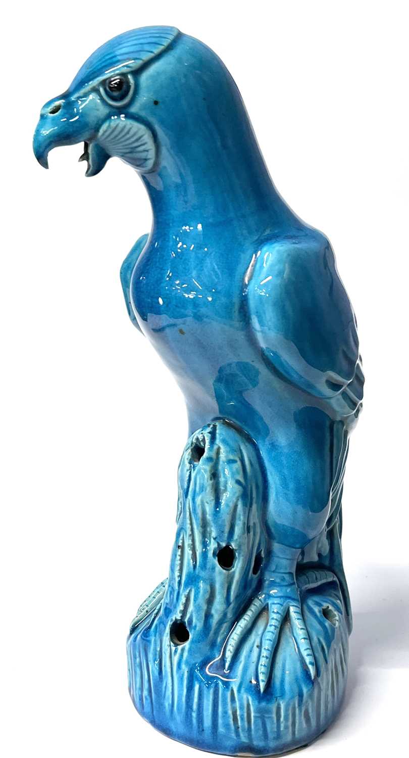 Lot 338 - A Chinese pottery model of a hawk with